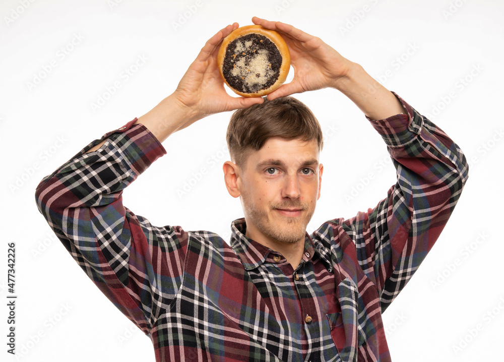 Young handsome tall slim white man with brown hair holding kolach on ...
