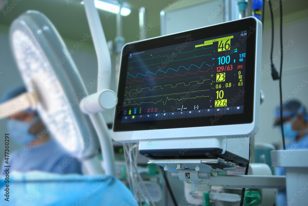 Heart rate and patient control monitor in hospital theater room during ...