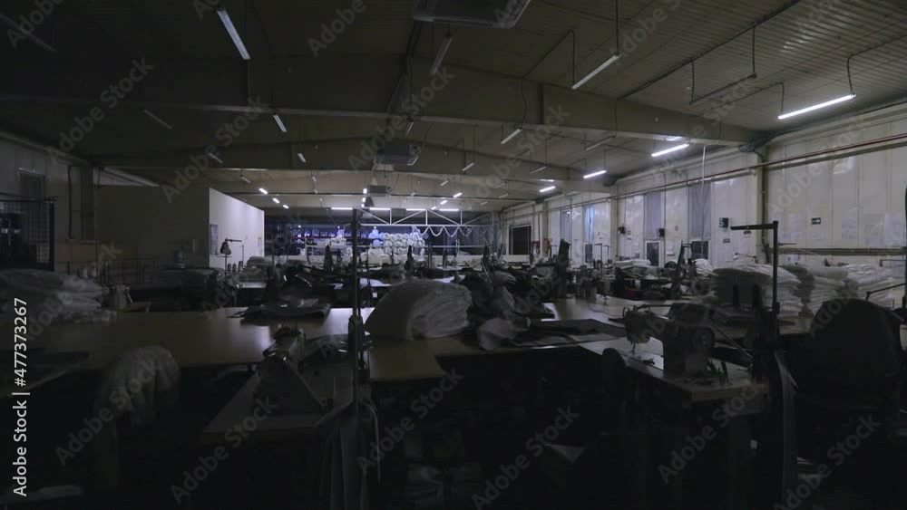 Turning off the lights in a large garment factory. End of the working ...