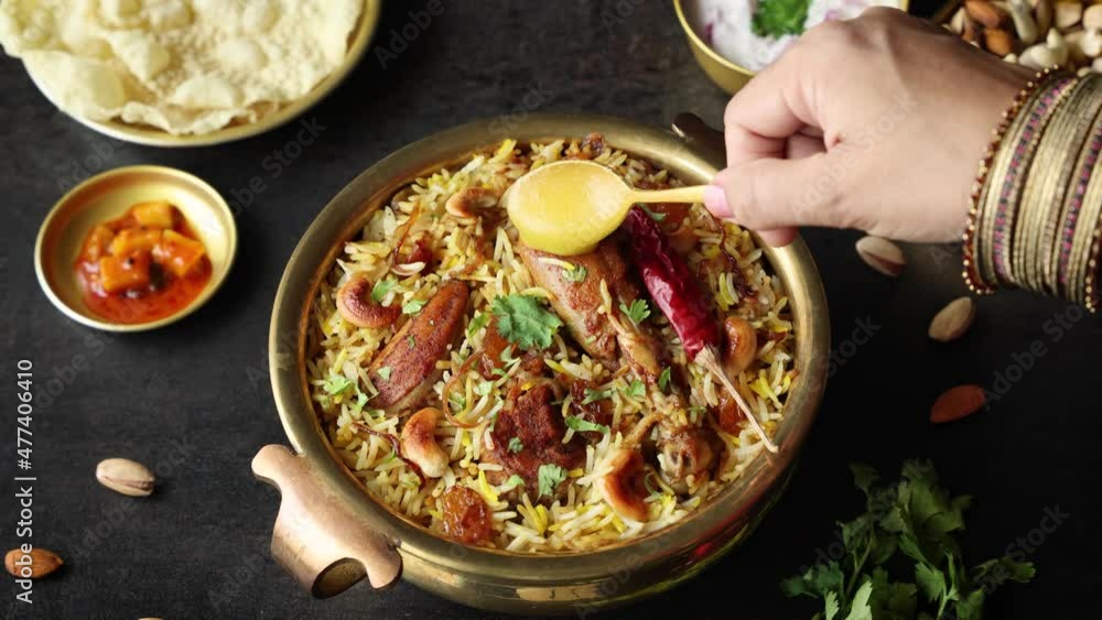 Chicken biryani Spicy Indian Malabar biryani Hyderabadi biryani woman ...