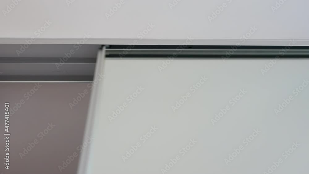 Mirrored doors open. The system of sliding doors in the wardrobe, the ...