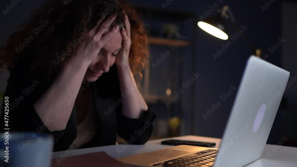Angry tired woman office manager are working late at night. Stressed ...