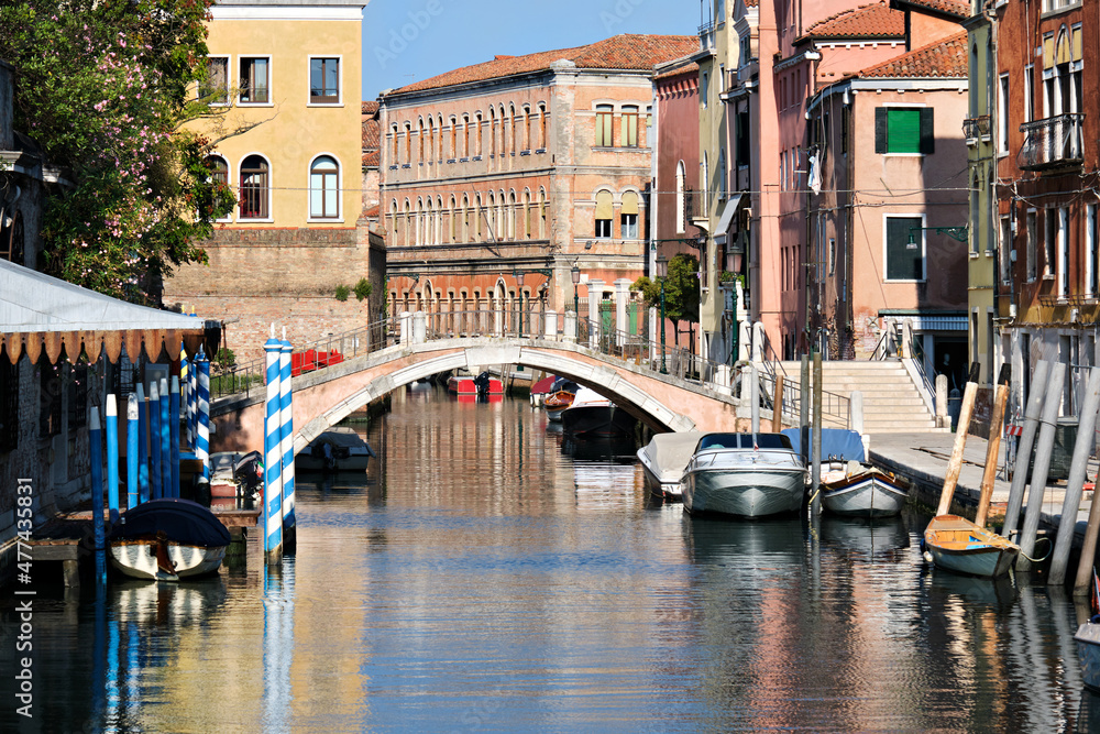 Venice in Italy with footbridge across canal with reflection. Old ...
