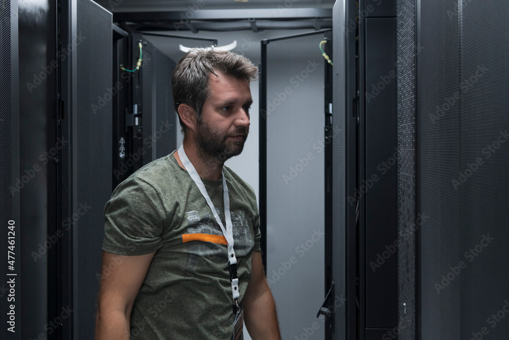 IT engineer working In the server room or data center The technician ...