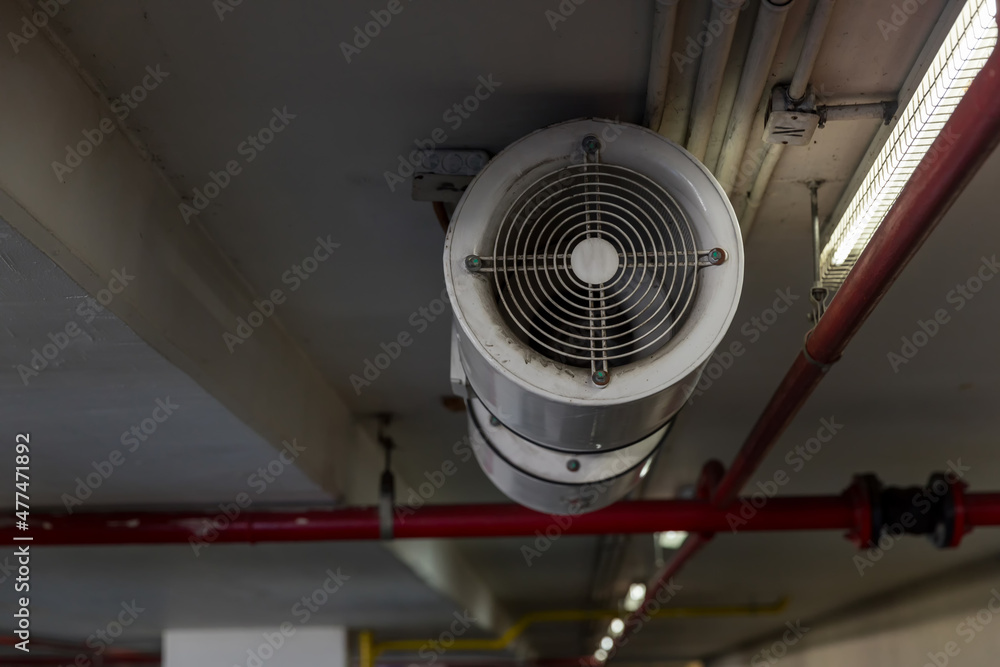 Fan in modern building Parking in door. Parking building ventilation ...