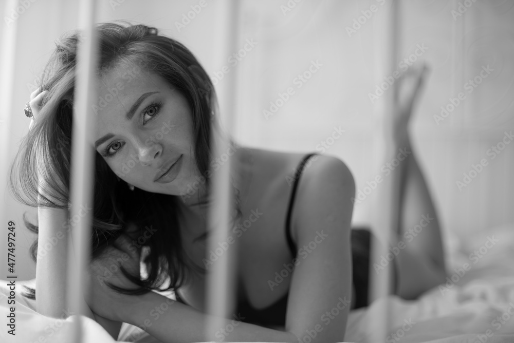 Beautiful And Sexy Brunette Young Woman Wearing Black Lingerie In Bed