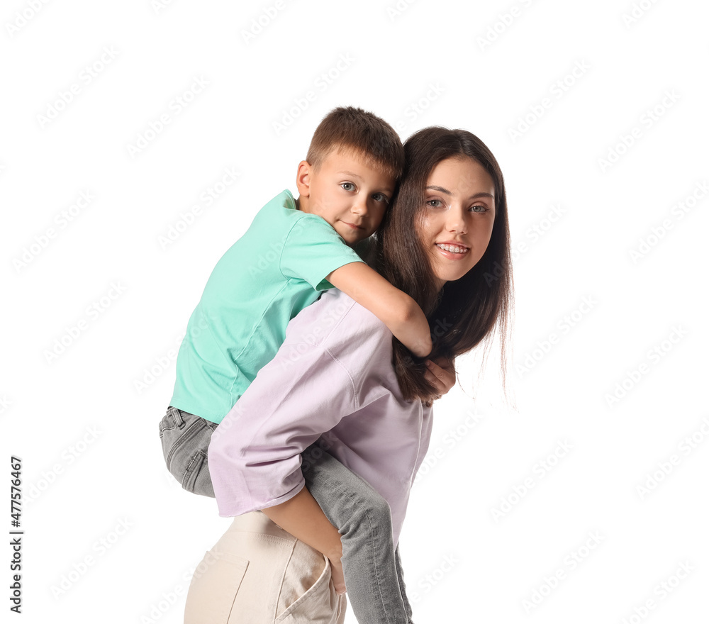 Teenage girl carrying pickaback her little brother on white background ...