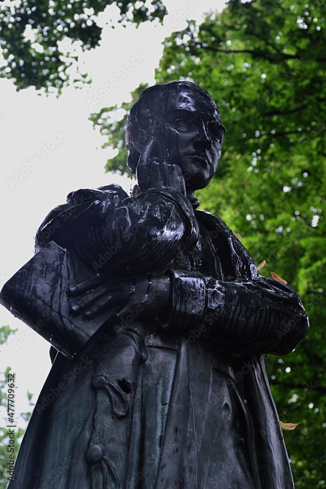 Wet black coloured statue of Slovak linguist and priest Anton Bernolak ...