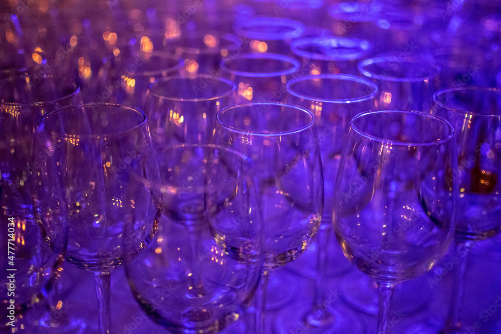a collection of wine glasses on a bar counter ready to use abstract ...