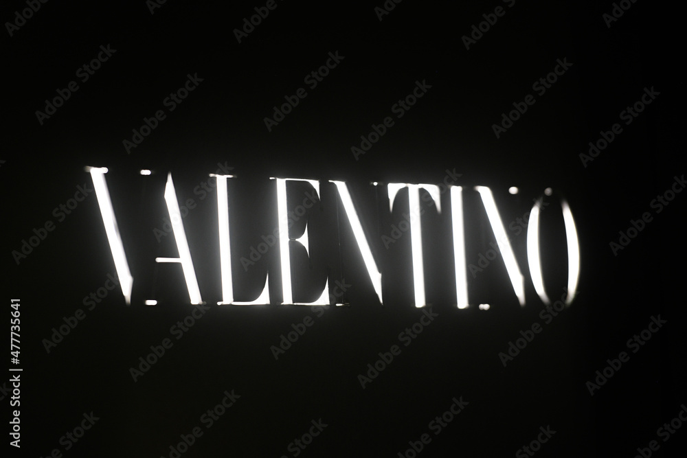 Valentino logo displayed on a facade of a store in Milan. Stock Photo ...