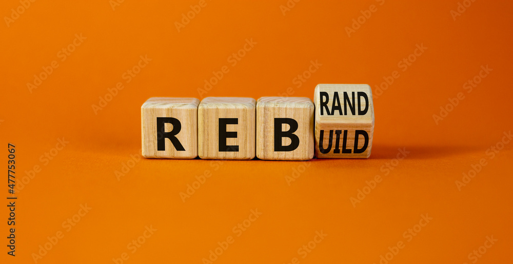 Rebrand and rebuild symbol. Turned a wooden cube and changed the word ...