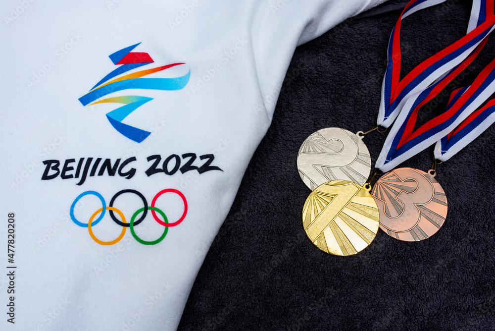 BEIJING, CHINA, JANUARY 1, 2022: Gold, silver and bronze, medal set on ...