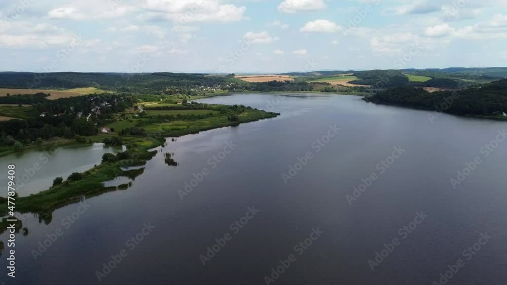 Reeds at Rakaca Reservoir. Lake and Trees. Shore and mountains in the ...