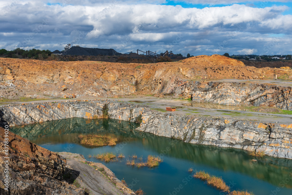 Open pit quarry with several levels in the excavation and the central ...