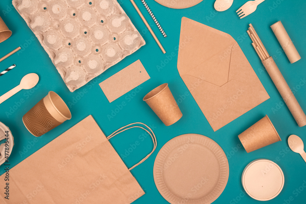 Flat lay with eco-friendly tableware and sustainable packaging. Kraft ...