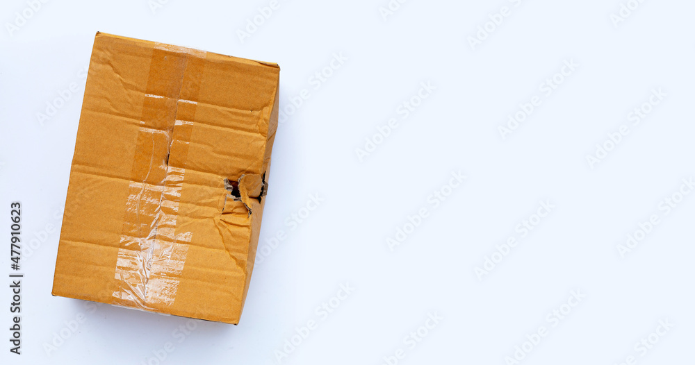 Damaged cardboard box with hole Stock Photo | Adobe Stock