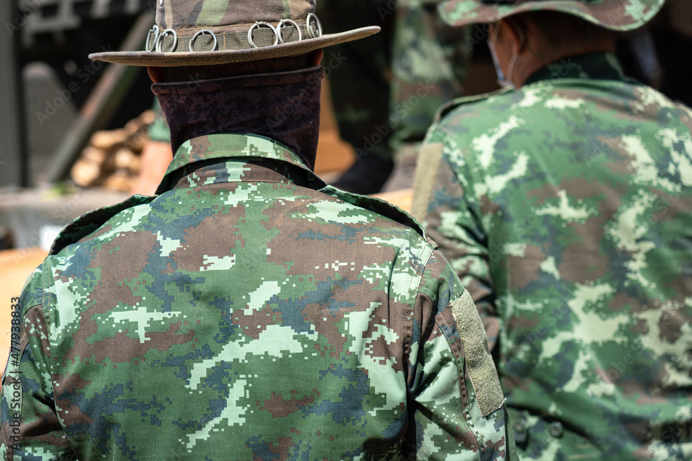 Group of a infantryman soldier which is wearied camouflage uniform, ready to perform the ...