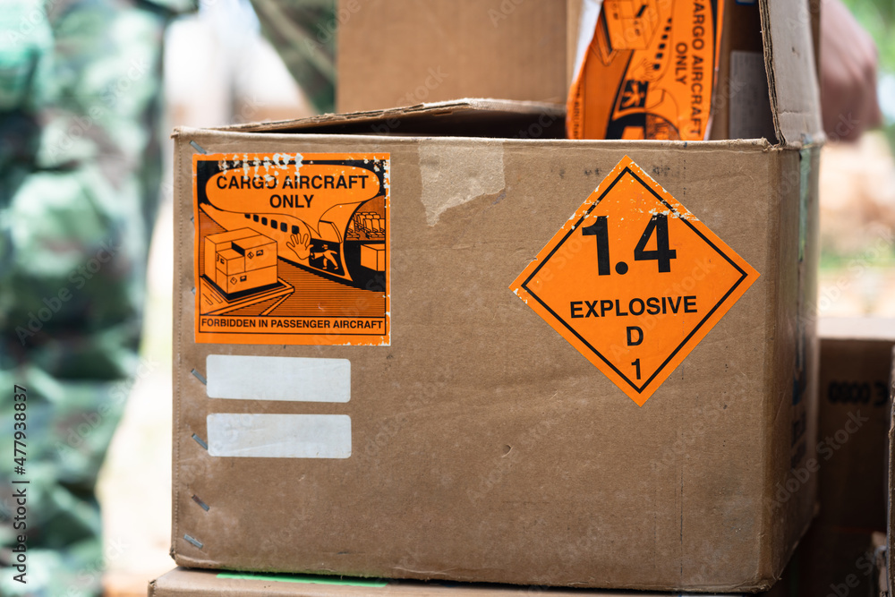 Explosive triangle placard sign on the carton box, to demonstrate the ...