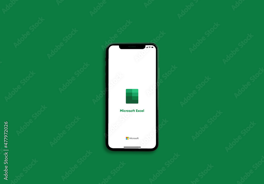 Microsoft Excel application on the smartphone screen on green ...