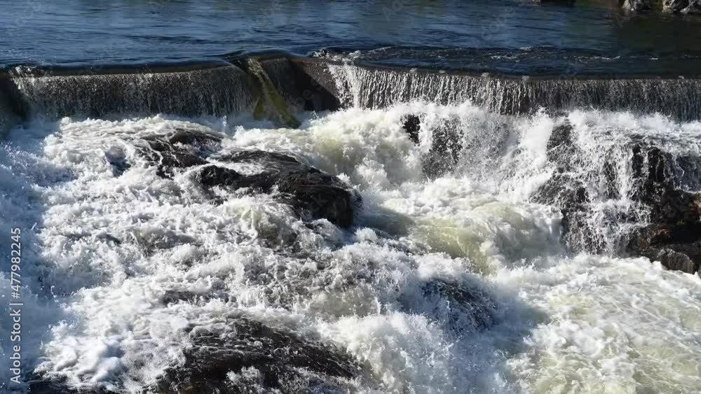 Hydroelectric dam with flowing water. Fairy waterfall at wild forest ...