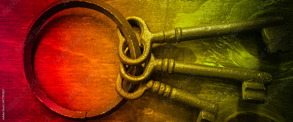 Lucky keys or three rugged metal keys chained in a circular ring on the ...