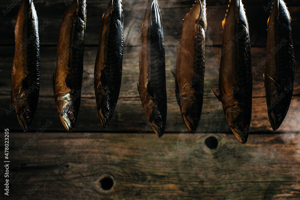 Fish Smoking Process For Home Use. fish hanging side by side in a ...