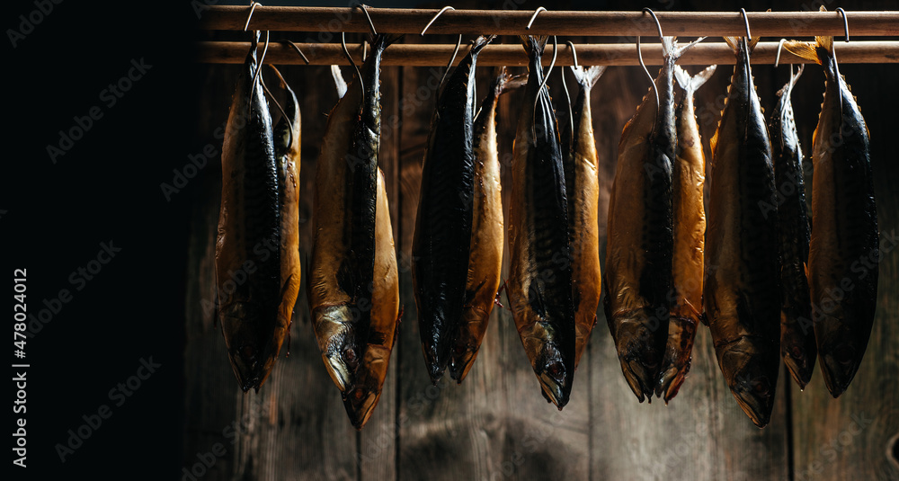 golden smoked fish. Process For Home Use. fish hanging side by side in ...