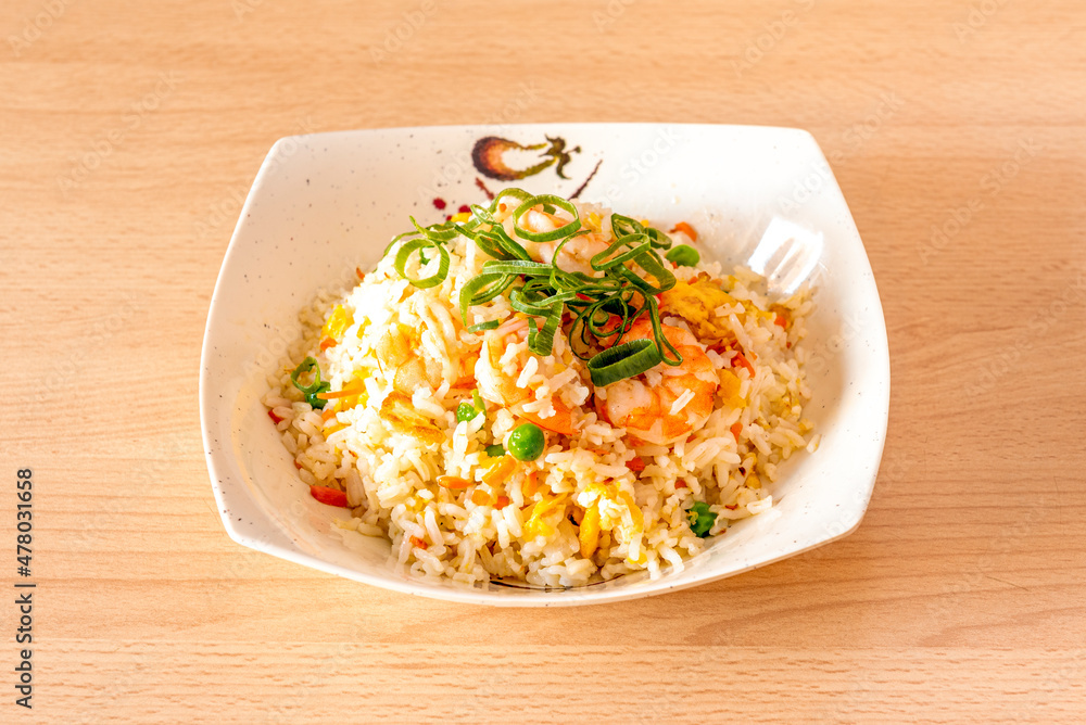 Japanese seafood yakimeshi is an oriental rice recipe that mixes ...