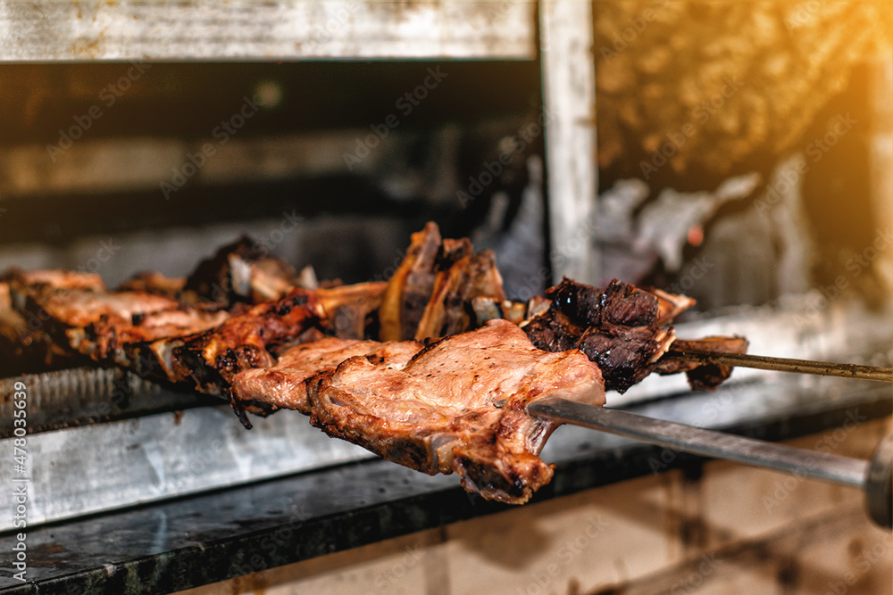 typical Brazilian barbecue in a rustic wood-fired grill Stock Photo ...