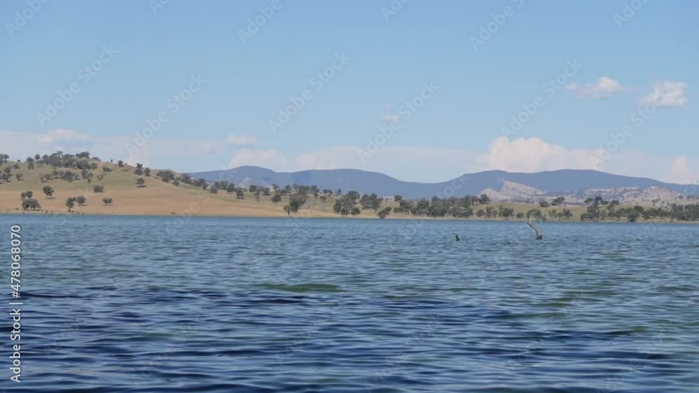 The blue sky with dark blue river of the Murray River, is a river in ...