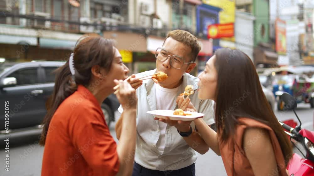 4K Group of Asian woman and LGBTQ people friends tourist enjoy eating ...