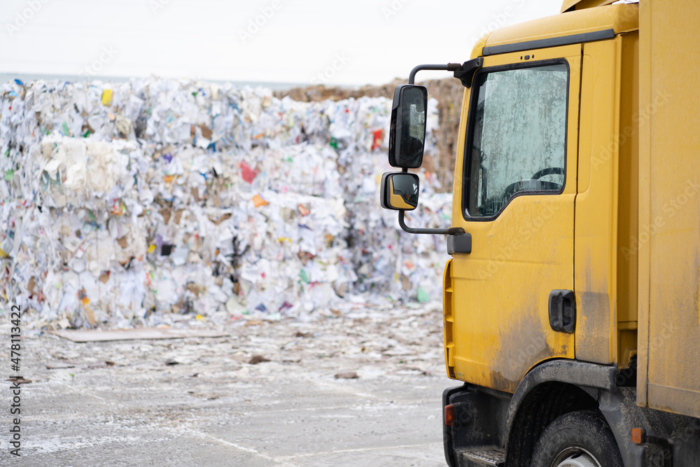 Cab of a yellow truck for transporting garbage and waste paper. Stack ...