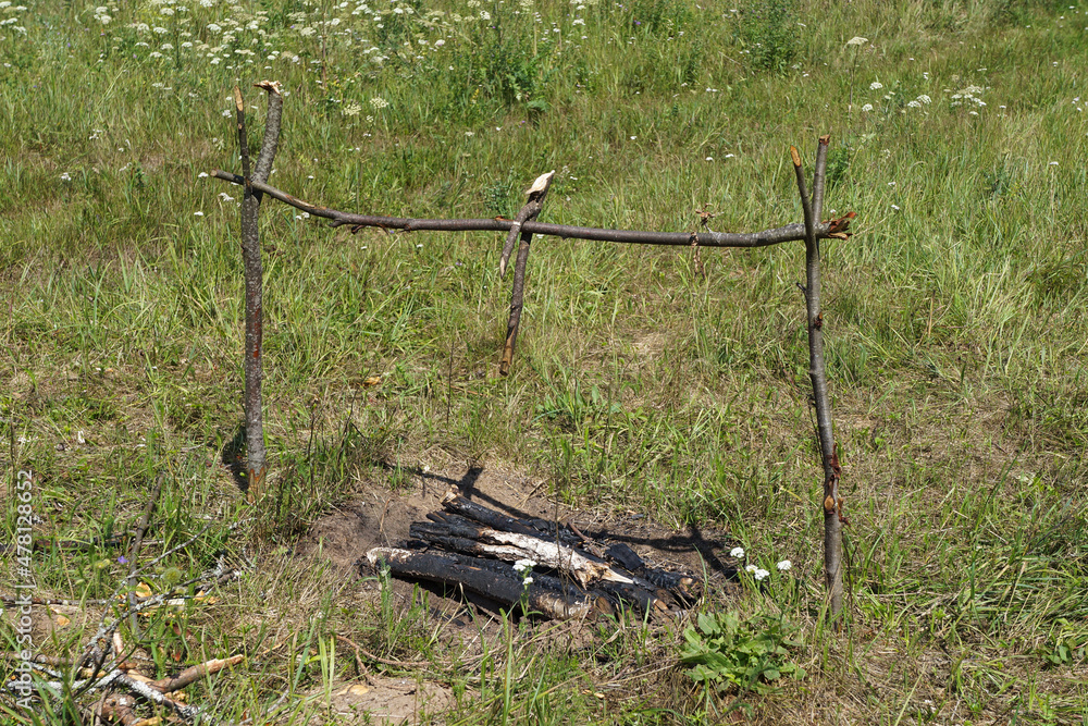 Extinguished bonfire in the meadow. Cooking on a hike. Outdoor ...