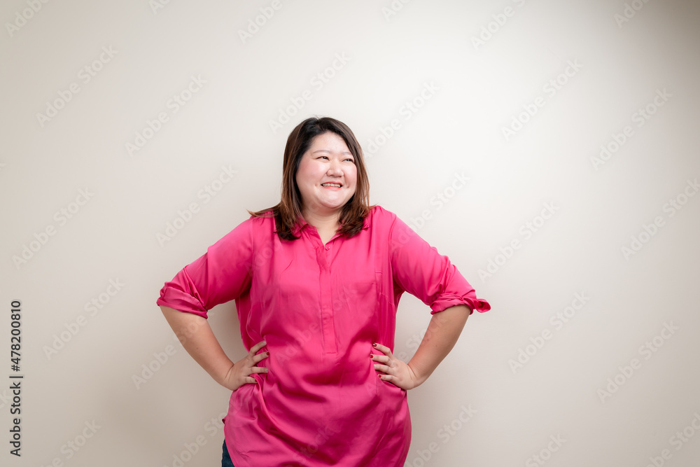 Fat woman pink shirt, Obese woman hand holding excessive belly fat ...