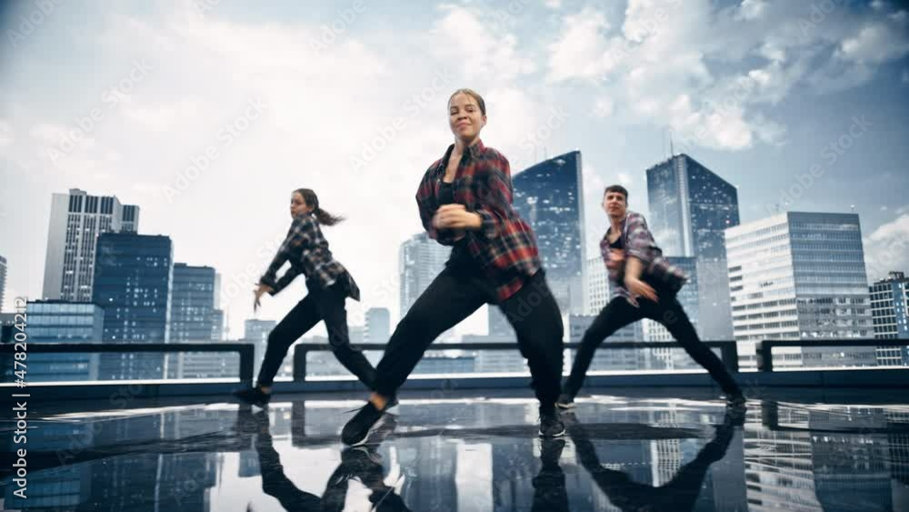 Diverse Group of Three Professional Dancers Performing a Hip Hop Dance ...