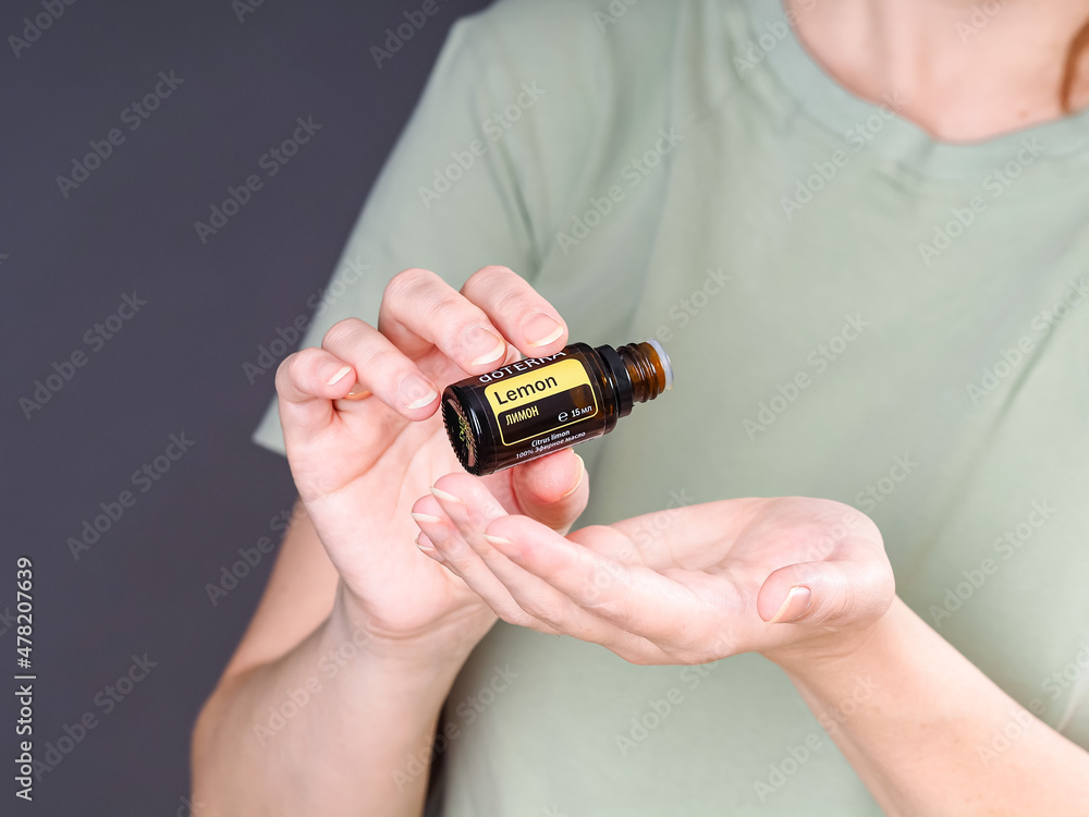 woman use dripping on her hand Doterra brand essential oils at a health ...