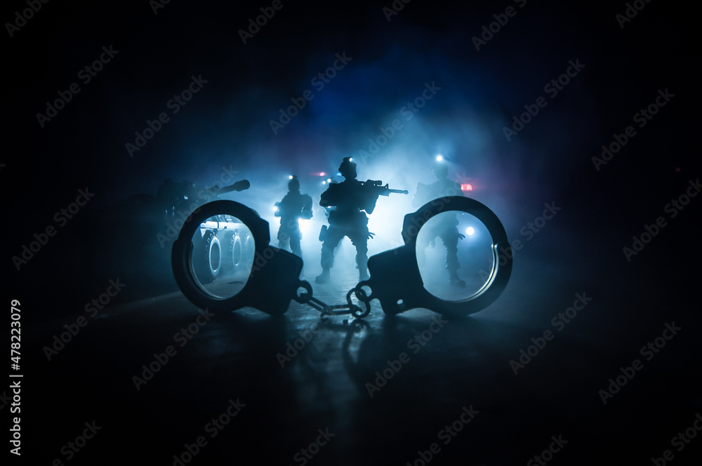 Police raid at night and you are under arrest concept. Silhouette of ...