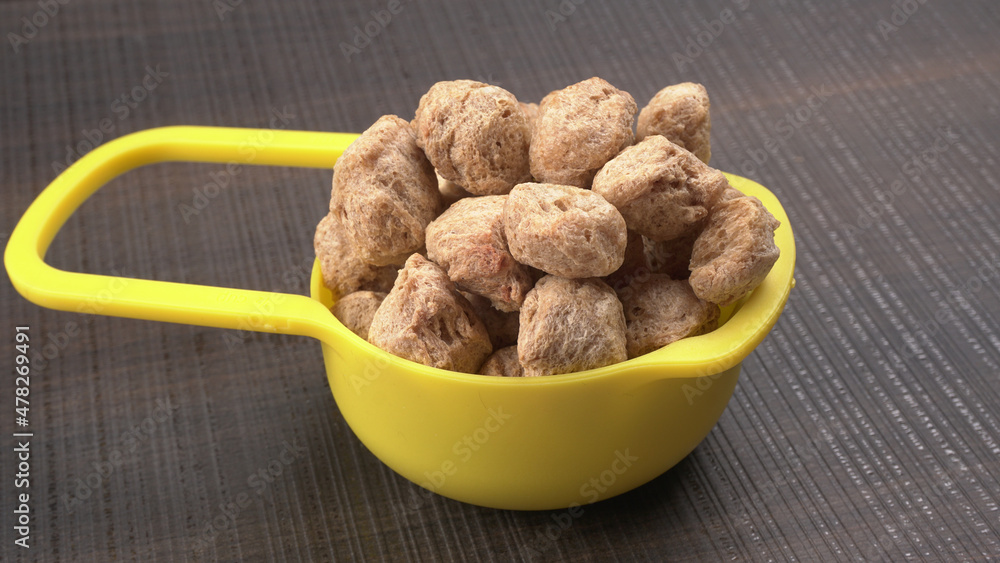 Raw soya chunks on dark background. Healthy, nutritious soybean meat ...