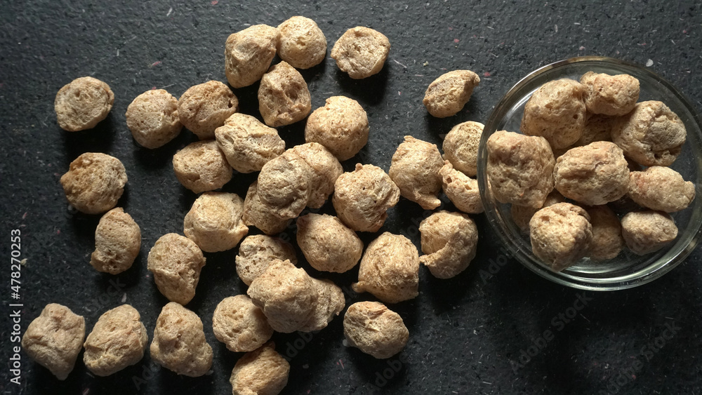 Raw soya chunks on dark background. Healthy, nutritious soybean meat ...