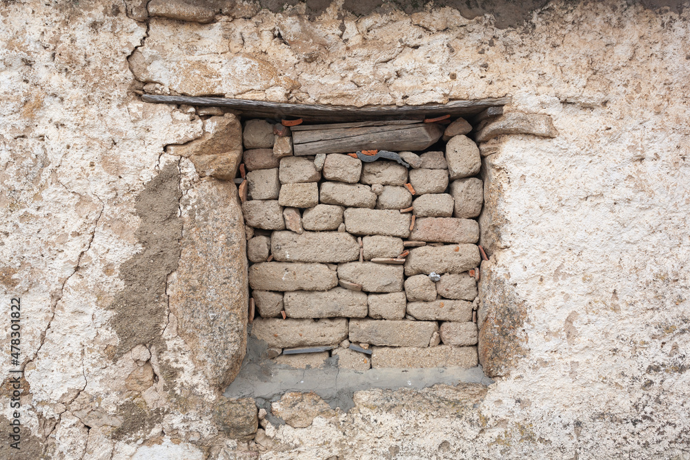An old wooden lintel window, a peculiar example of the typical ...