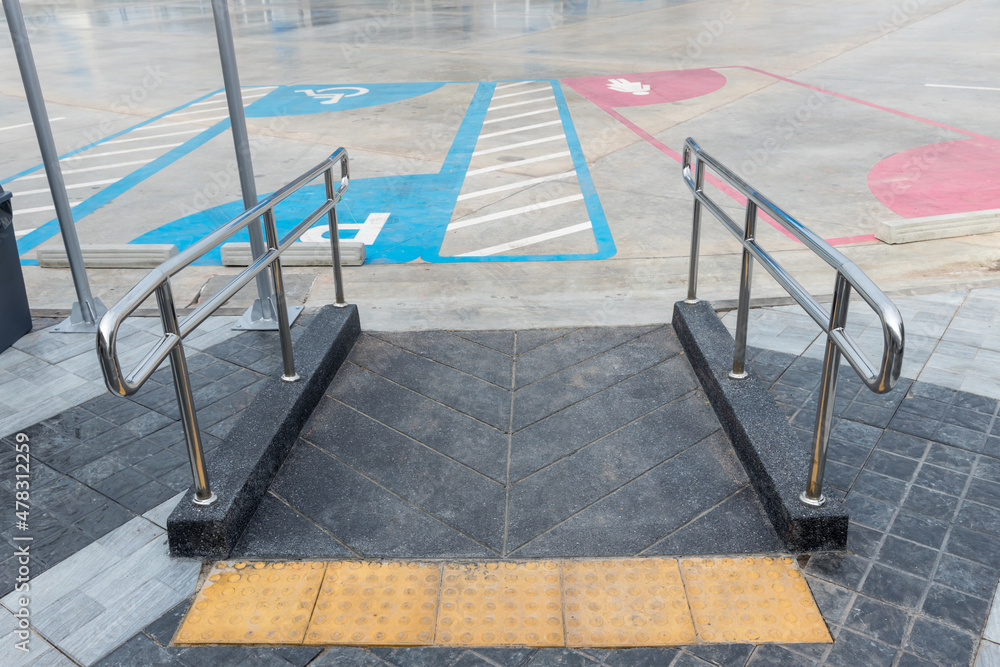 Concrete ramp way with stainless steel handrail for support wheelchair ...
