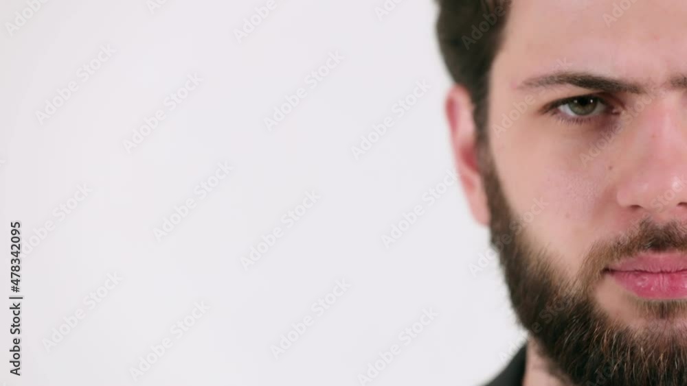 Close-up look of a caucasian man with a beard on white background 4K ...