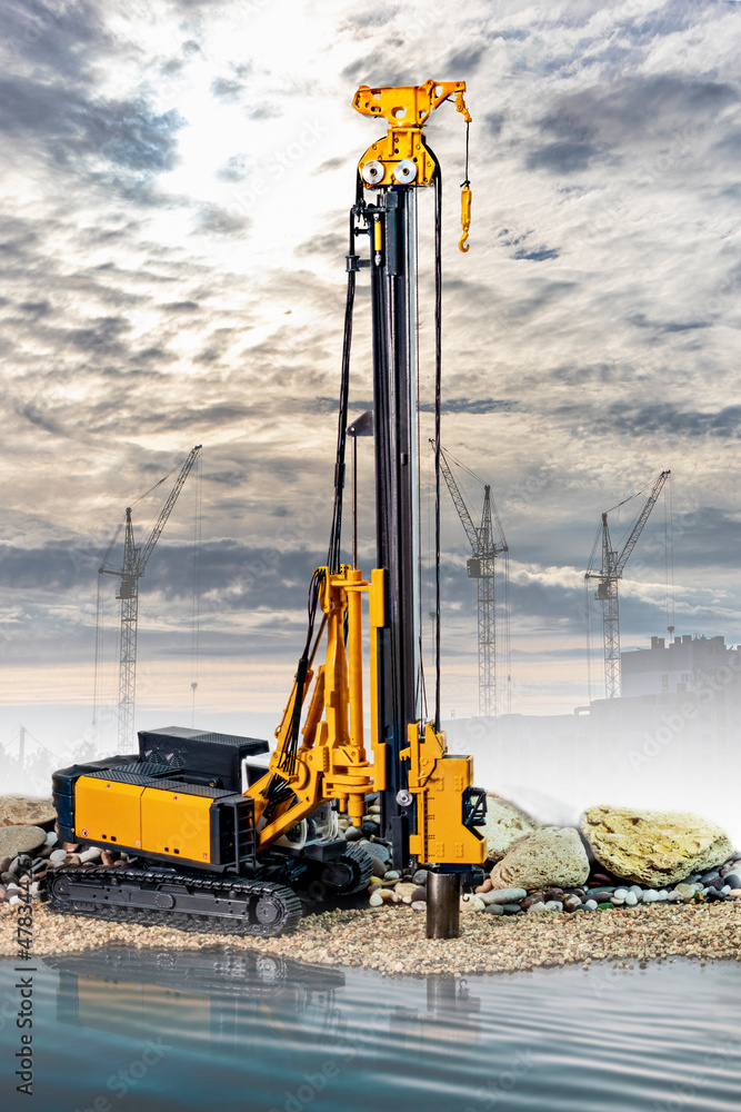 Powerful hydraulic drilling rig. Installation of bored piles ...