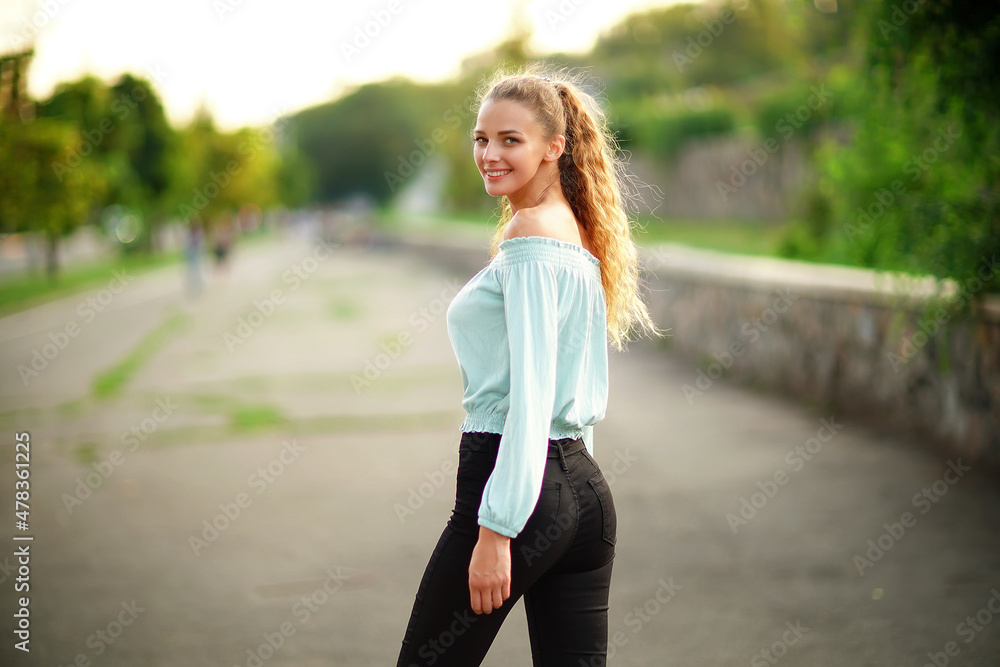 Back view of stylish smiling beauty girl who posing while wears in ...