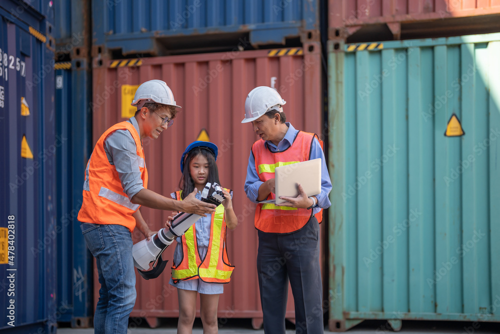 Engineer Teachers teaching a girl about robot hand In Science Robotics ...