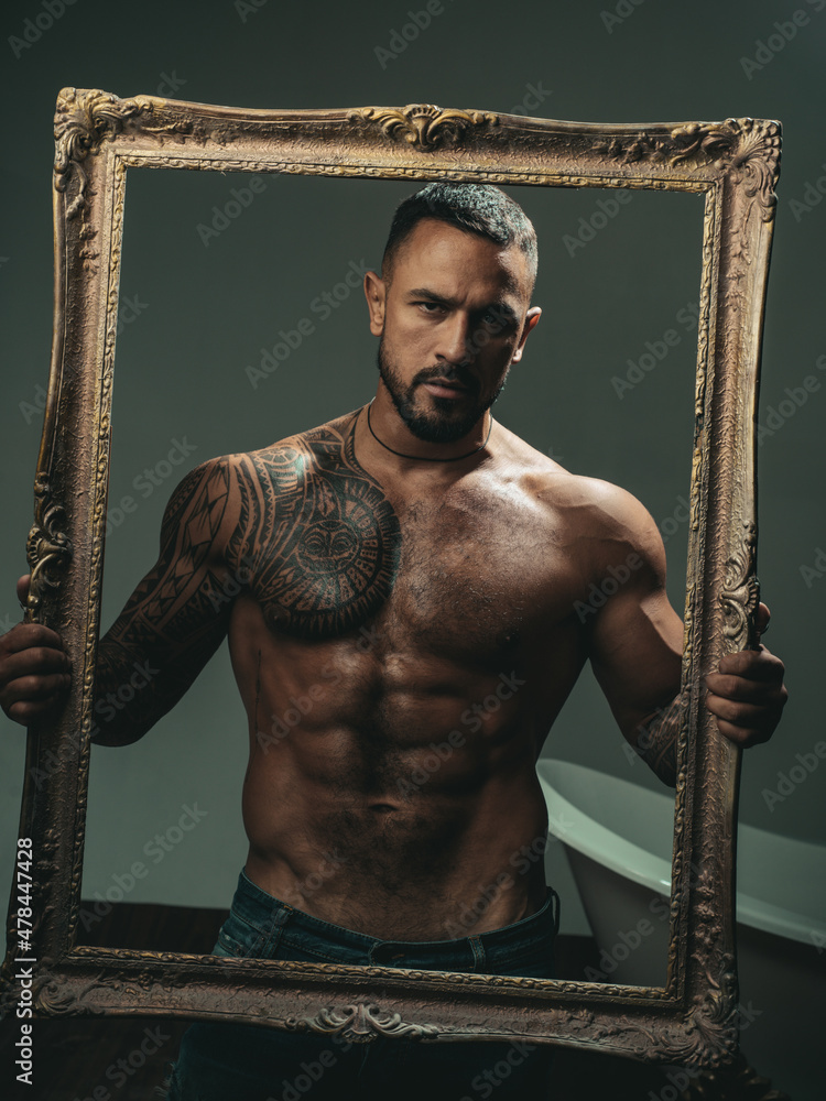 Brutal man, handsome serious male model. Tattooed and elegant hipster ...