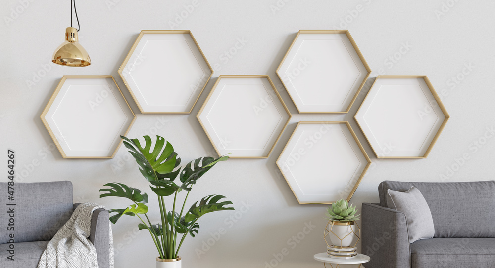Gold hexagon blank photo frames mockup hanging on white interior wall ...
