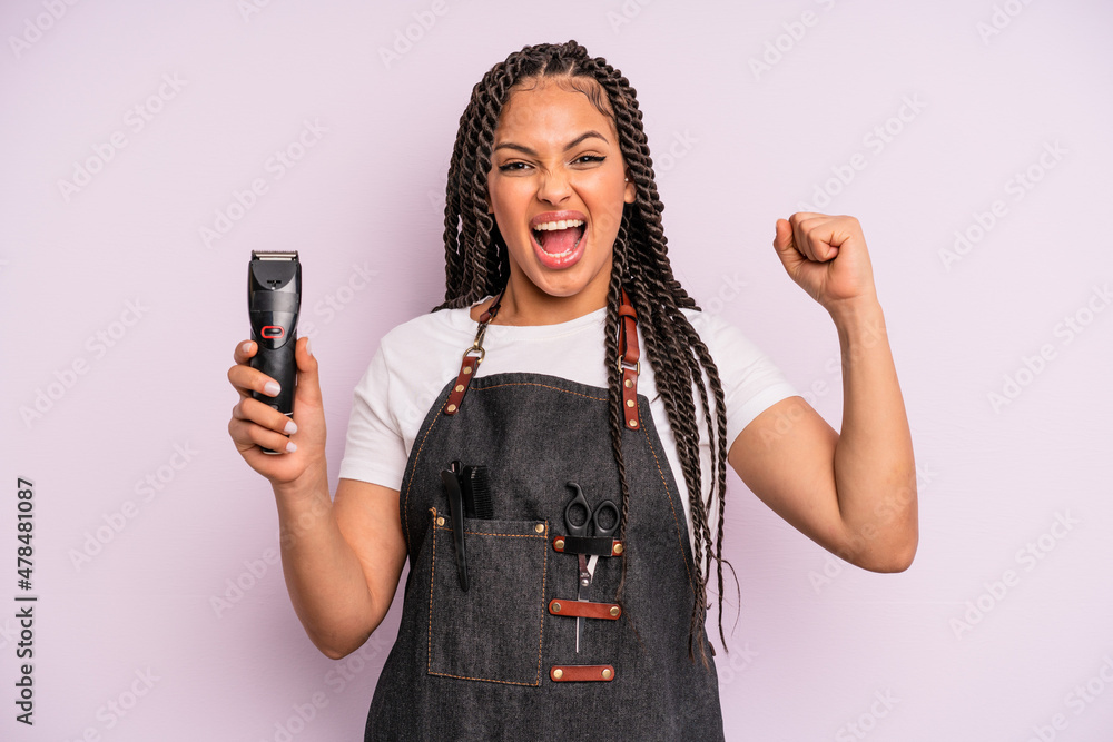 black afro woman shouting aggressively with an angry expression. barber ...