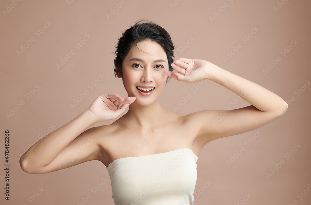 Beautiful Young Asian woman lifting hands up to show off clean and ...