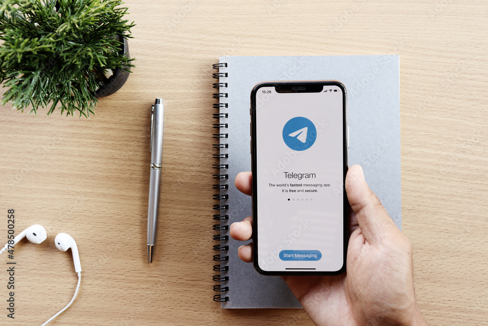 Telegram app on smartphone screen, desk background : Chiang Mai ...